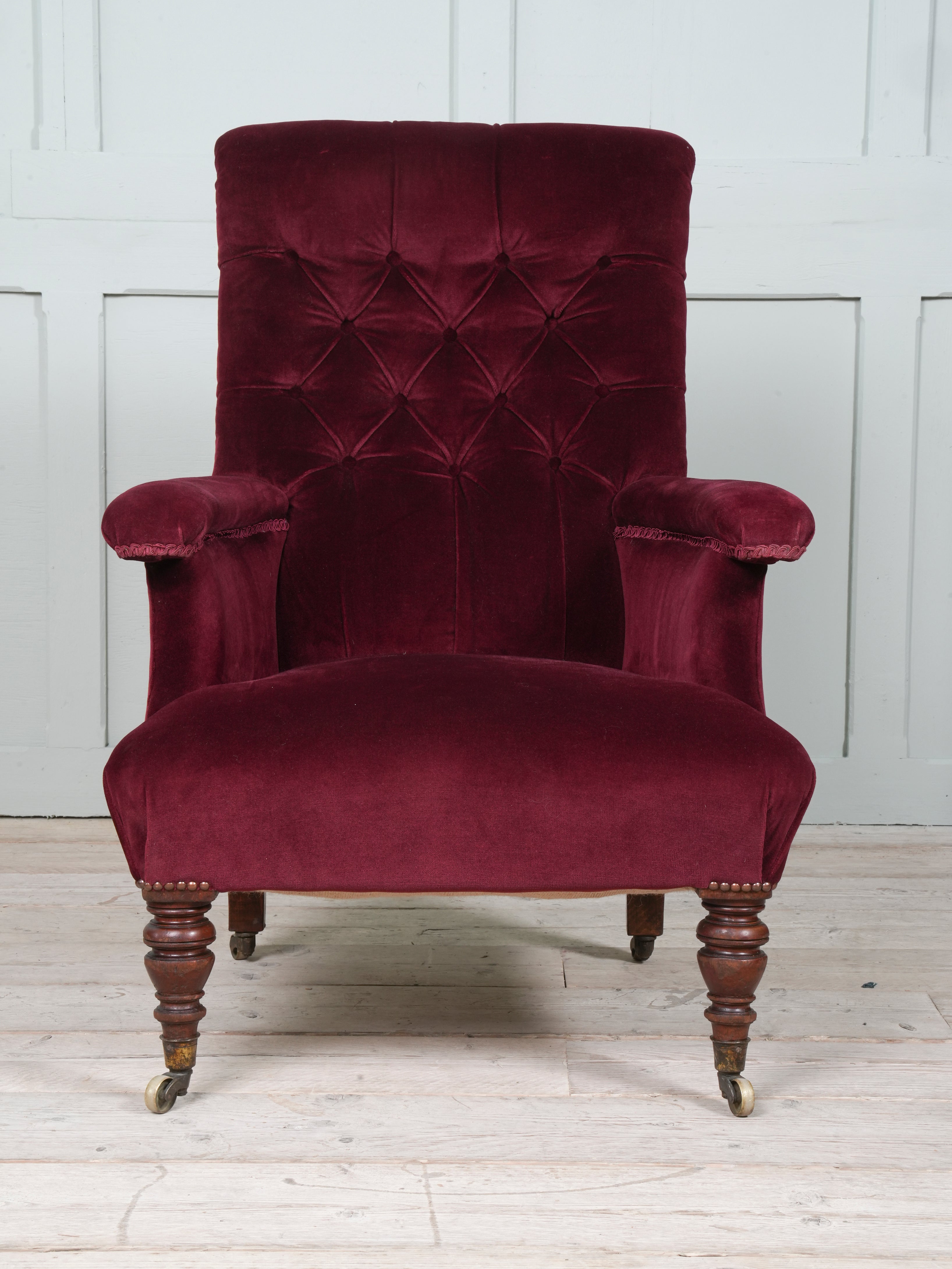 A Howard & Sons Buttoned Back Armchair | Drew Pritchard Ltd